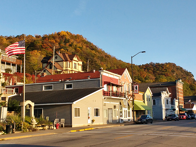 Enjoy the vibrant colors of autumn on the bluff as you explore the charming, historical storefronts below you.