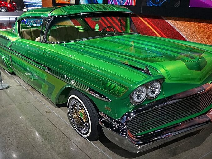 Cruising in style! This '58 Impala is greener than Kermit the Frog at a St. Patrick's Day parade. Talk about turning heads!