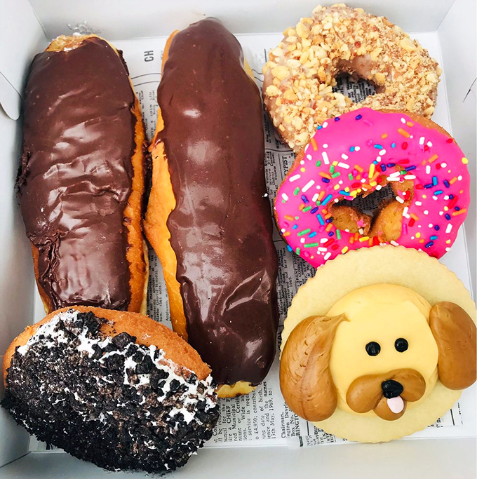 A box of joy! From classic glazed to whimsical creations, this assortment is like a party for your mouth waiting to happen.