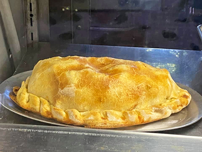 Behold, the golden globe of goodness! This isn't just a pasty; it's a handheld hug from a Cornish grandmother you never knew you had.