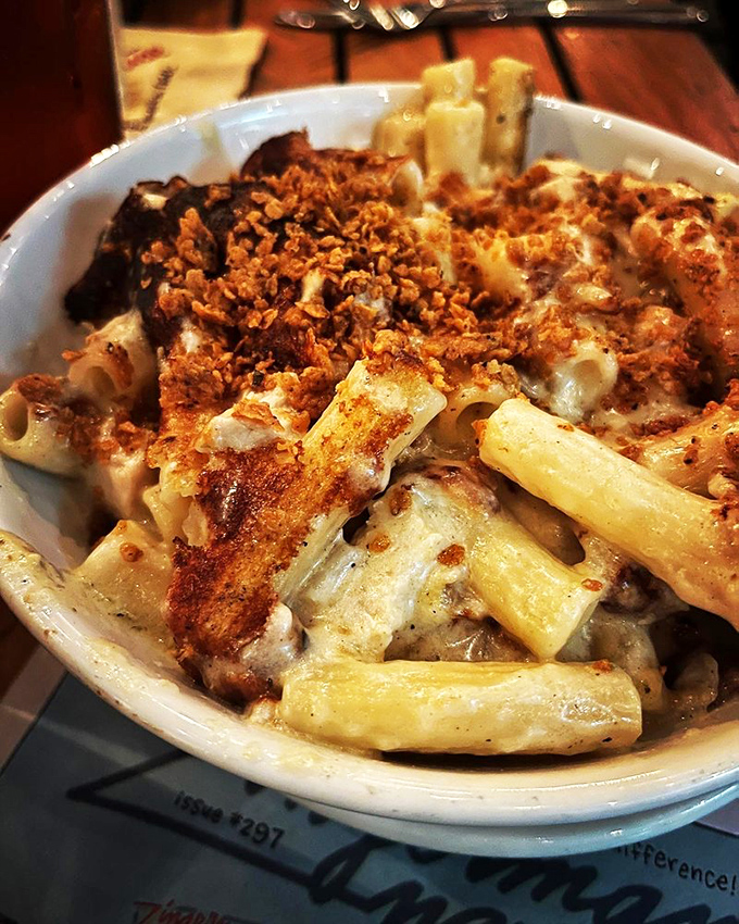 Mac and cheese that's had a glow-up. With fried chicken on top, it's comfort food that's dressed for the red carpet.