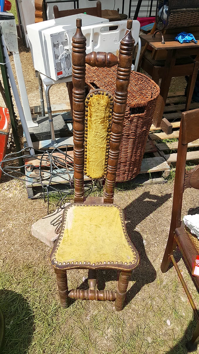 Sit a spell! This vintage chair is serving up comfort with a side of character &ndash; it's seen more stories than your favorite librarian.