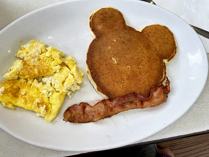 Who says you can't play with your food? This Mickey Mouse pancake brings out the kid in all of us. Don't forget to dunk those ears!