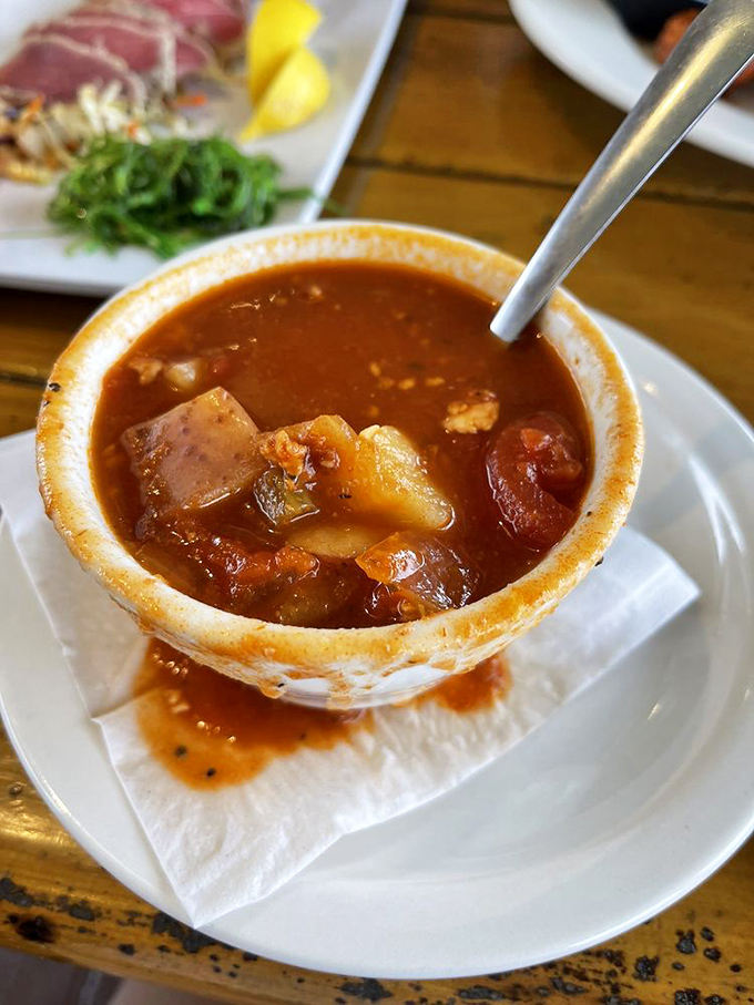 Minorcan Conch Chowder: A bowl of local legend. It's like Florida's answer to New England clam chowder, with a spicy twist.