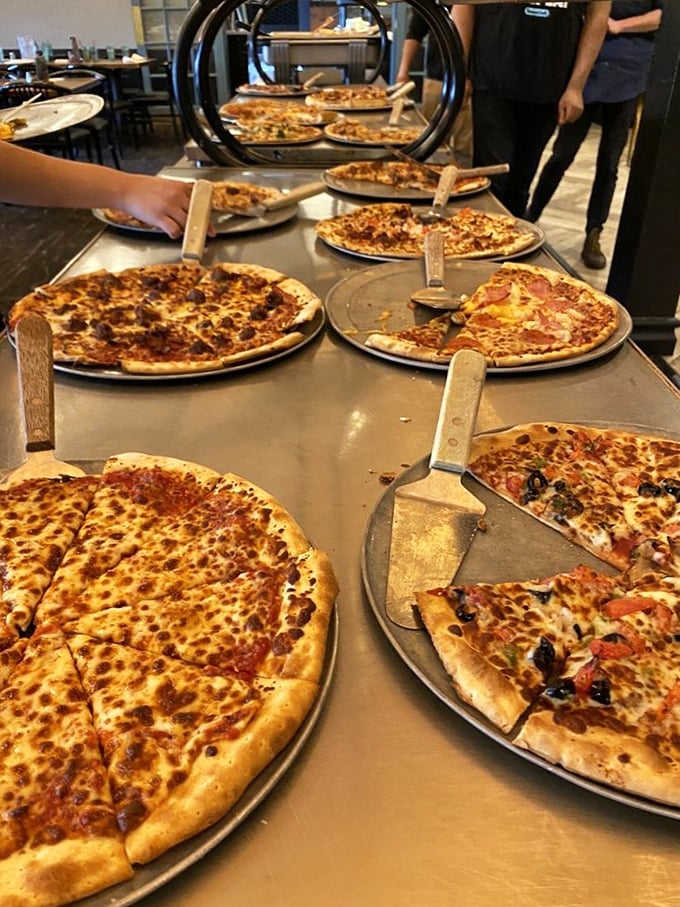 Pizza, pizza everywhere, and every slice to eat! This buffet of circular delights is like Willy Wonka's factory, but for pizza lovers.