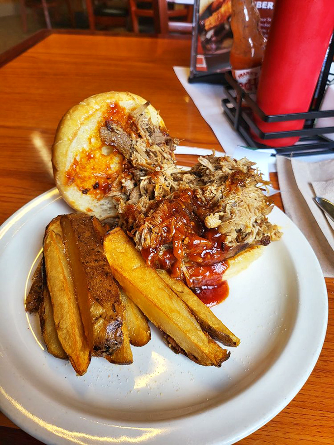 This pulled pork sandwich is so tender, it practically pulled itself onto the plate. Served with a side of crispy potato wedges for maximum comfort.