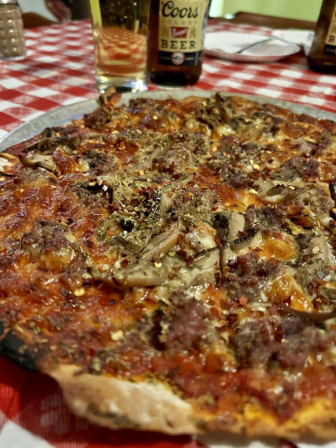 A fungi's dream come true! This sausage and mushroom combo is the Batman and Robin of the pizza world - a dynamic duo.