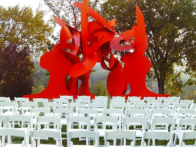 "Red alert! Art incoming!" This vibrant sculpture seems ready to dance right off its pedestal and into your heart.