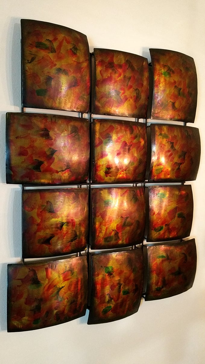 Art that's seen some living! This eclectic wall decor piece could be the conversation starter your living room's been missing.