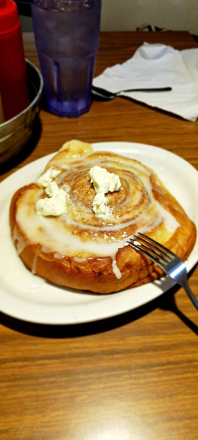 Spiral into deliciousness! This cinnamon roll is so gooey and warm, it's like a sweet, edible hug for your soul.
