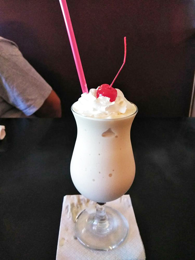 Shake it up, baby! This creamy concoction, topped with a cherry, is the stuff of soda fountain legends.