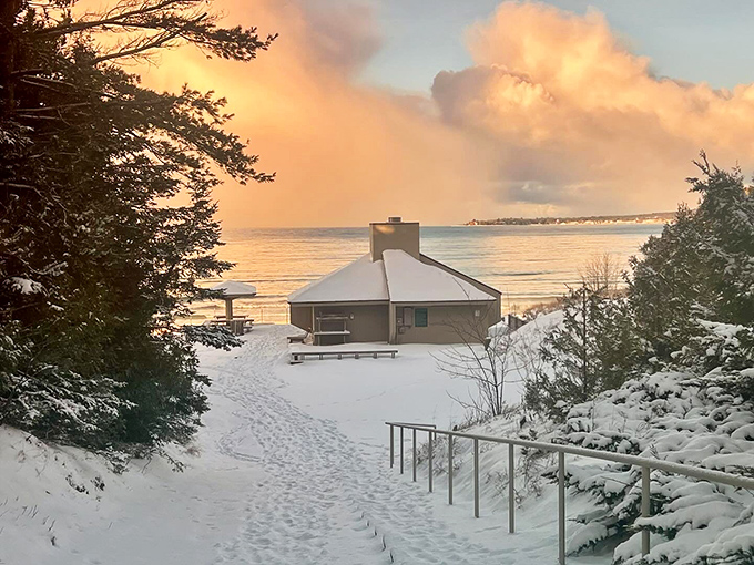 Petoskey's beachfront: Where summer dreams and winter wonders collide. That red clock could be timing how long it takes for your toes to freeze in the icy water.