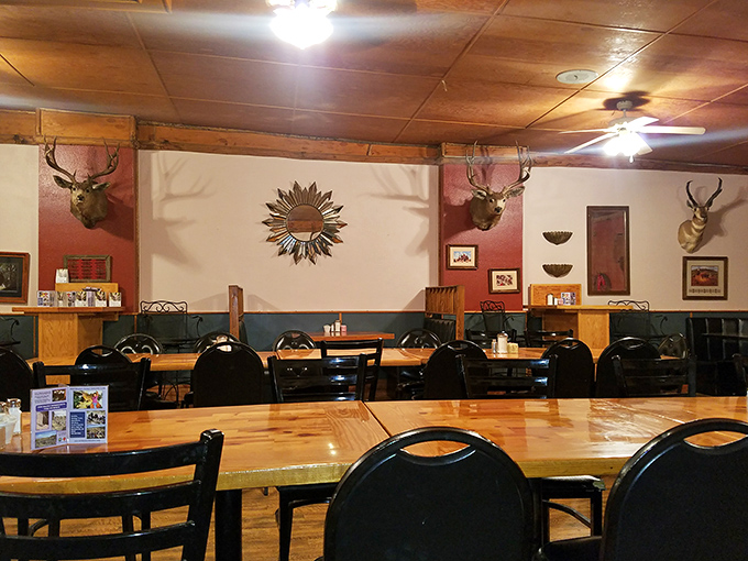 Wagon wheels and warm wood tones. It's like dining in a time machine set to 'Cozy Frontier'.