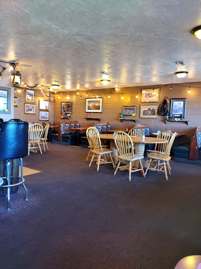 Strings of lights and local art transform this dining area into a cozy haven. It's like eating in your cool aunt's living room.