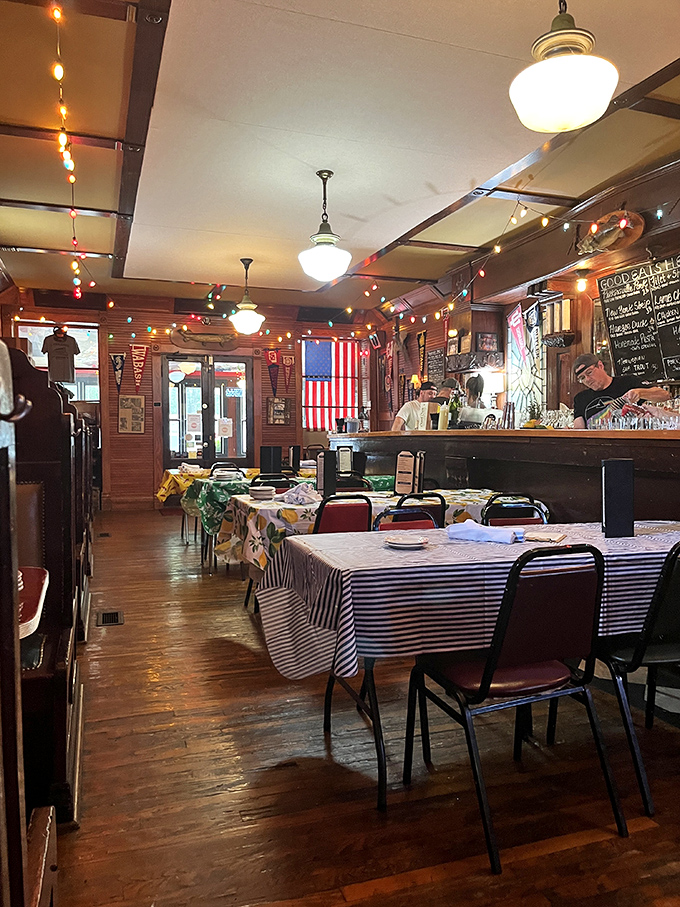 The dining area: where mismatched chairs and colorful tablecloths come together in perfect harmony. It's like a hug for your eyes... and soon, your stomach.