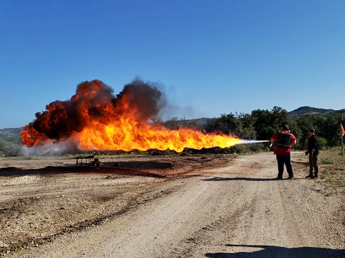 Hot stuff coming through! This flamethrower demonstration proves that sometimes, the best way to solve a problem is to burn it.