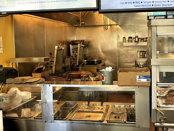 Where the magic happens! This bustling kitchen is like a well-oiled machine, churning out crispy, juicy delights faster than you can say "extra napkins, please!"