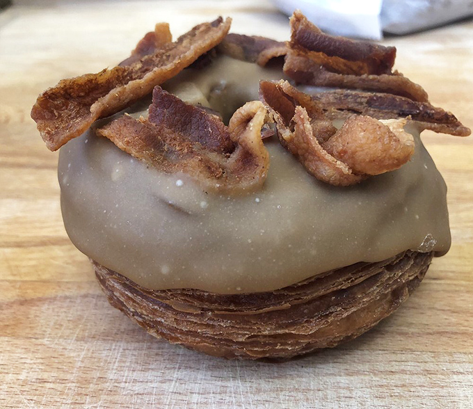 When breakfast can't decide what it wants to be. This maple bacon cronut is the superhero crossover event of the pastry world.