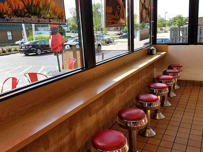 Window seat to happiness. These stools offer prime people-watching real estate with a side of sugary indulgence.