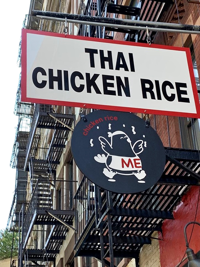 Look up! This sign is like a beacon of hope for hungry souls. Follow the chicken, my friends!