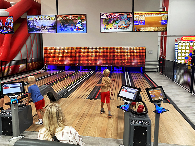 Strikes, spares, and neon lights. This bowling alley is what the Flintstones would build if they time-traveled to Tomorrowland.