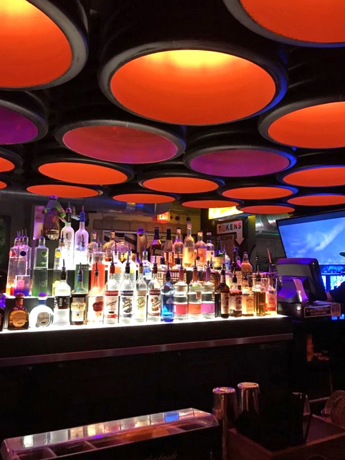 Liquid courage, meet liquid nostalgia. This isn't just a bar - it's a time machine in a glass, complete with neon-hued memories.