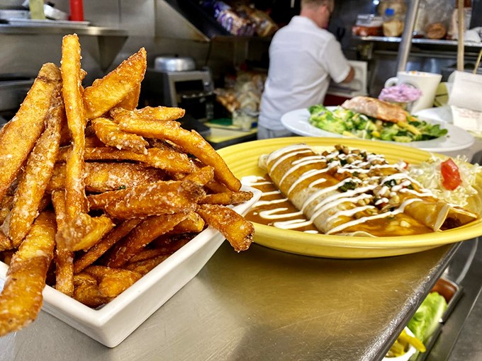 Fries that could make a Frenchman weep with joy, paired with a wrap that's tighter than your jeans after Thanksgiving dinner.