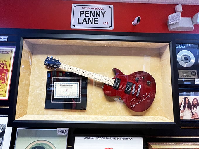 Strings attached? You bet! This guitar display hits all the right notes for Beatles fans and six-string enthusiasts alike.
