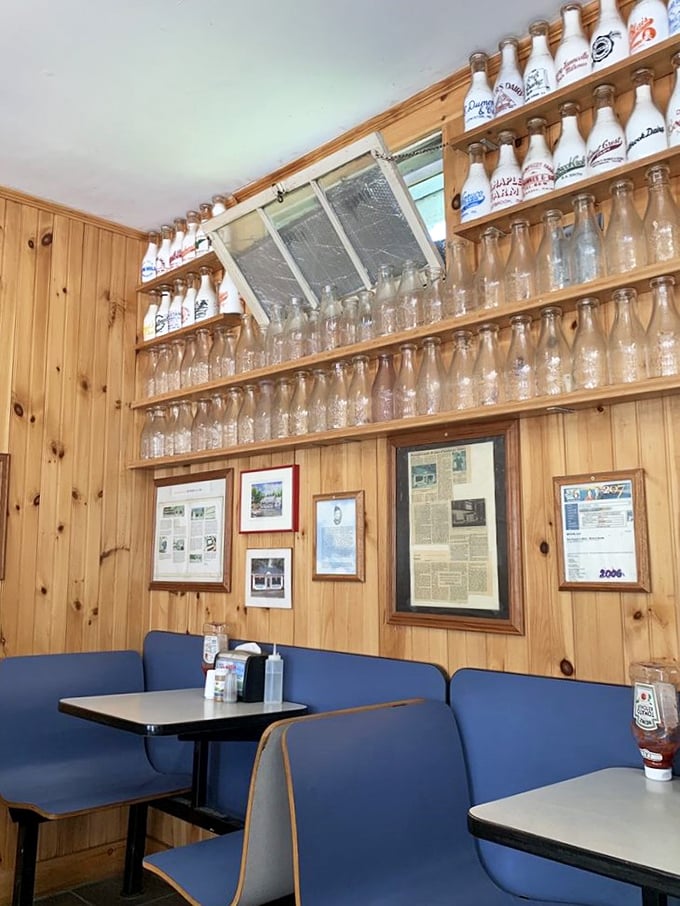Bottle cap heaven! These vintage milk bottles lining the walls are a nostalgic nod to days gone by, adding charm to every bite.