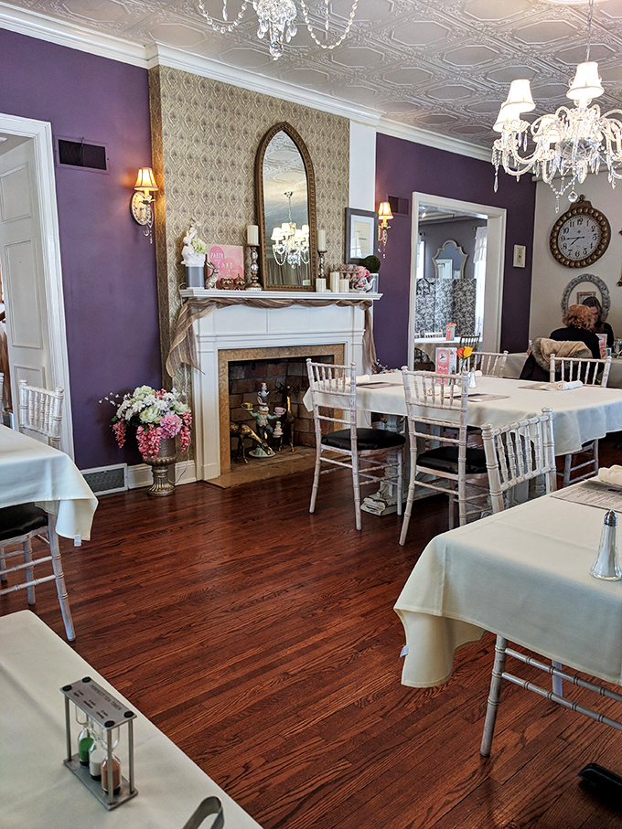 Purple reigns in this regal dining room! With its ornate fireplace and chandeliers, it's the perfect backdrop for your own royal tea party.