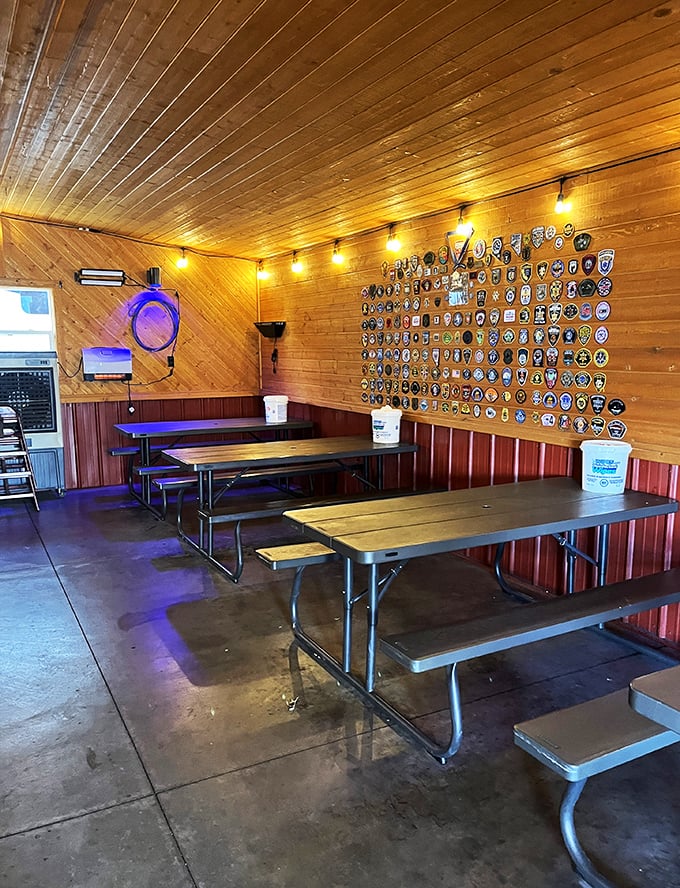 Where barbecue dreams are born! This rustic interior, complete with badge-adorned walls, screams "meat sanctuary."