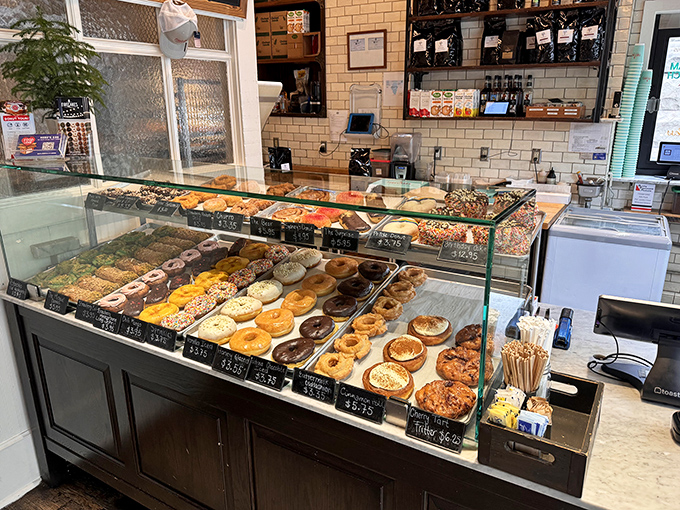Donut heaven is real, and it's right here! This display case is like a museum of edible art, each piece more tempting than the last.