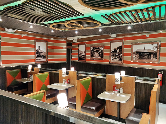 Retro chic meets modern comfort in this diner's interior. It's like the Jetsons and the Flintstones collaborated on a restaurant.