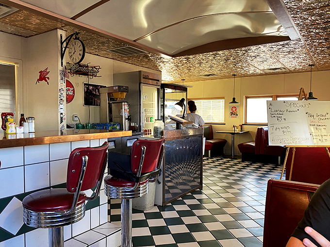 Red booths, chrome accents, and a ceiling that sparkles like a disco ball. It's not just a diner, it's a time machine with a side of hash browns.