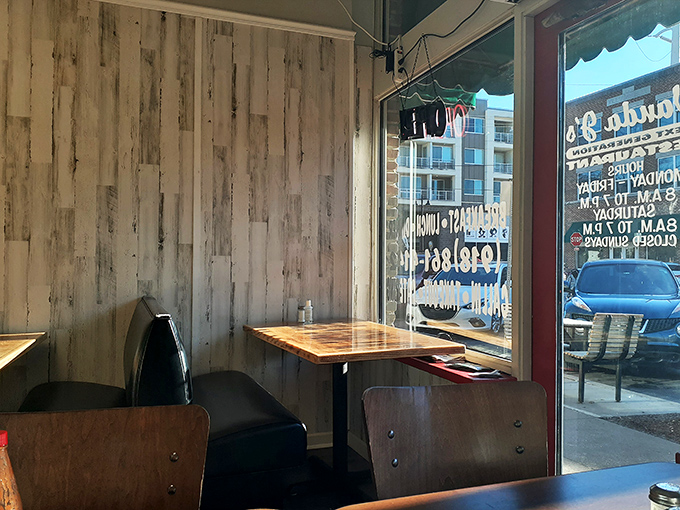 Rustic charm meets comfort food heaven. This corner booth is calling your name – resistance is futile!