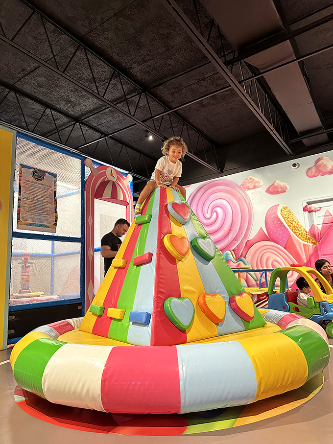 Reach for the sky on this colorful climbing wall. It's like scaling a giant pack of Starburst - just don't try to eat the handholds!