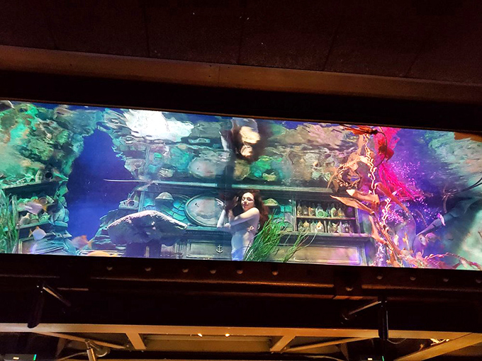 Is that a mermaid or the world's most graceful bartender? Either way, she's serving up magic with a side of bubbles.