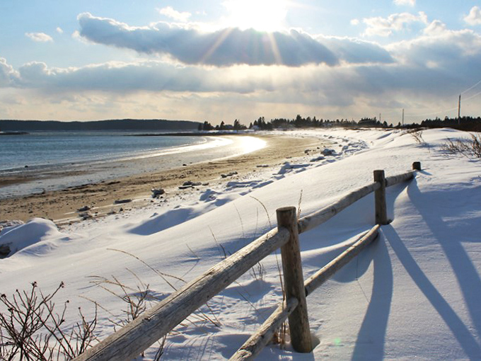 Winter's frosty embrace. Snow-dusted shores and icy waters prove that Roque Bluffs isn't just a summer fling. It's a year-round beauty that knows how to rock a winter coat.