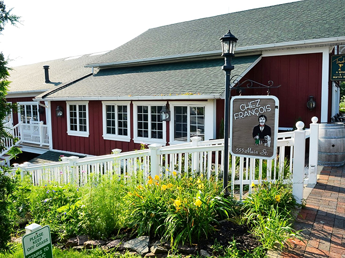 Chez Francois: Where French cuisine meets farmhouse chic. This red exterior's more eye-catching than a rooster in a hen party.