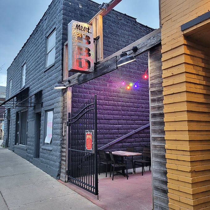 Urban edge meets smoky pledge. Meat BBQ's funky signage is your bat-signal for brisket in Lansing's night sky.