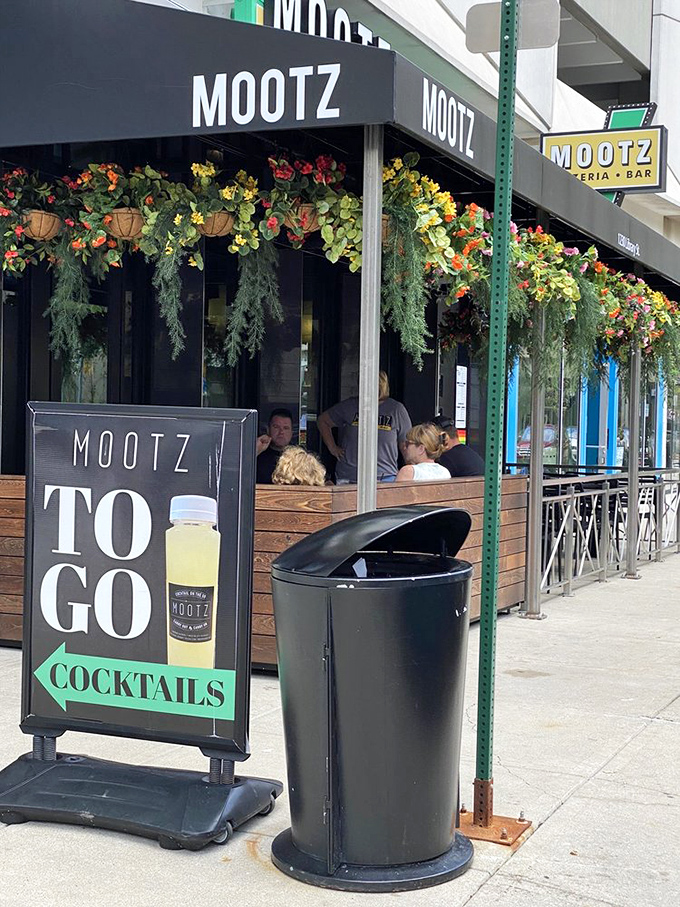 Mootz: Where pizza meets party! This outdoor seating is perfect for people-watching with a side of pepperoni.
