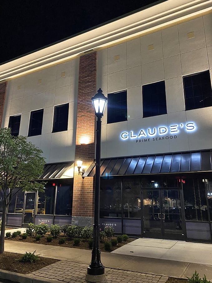 Poseidon's five-star restaurant? Nope, just Claude's bringing ocean opulence to Perrysburg. That illuminated sign is like a lighthouse for foodies!