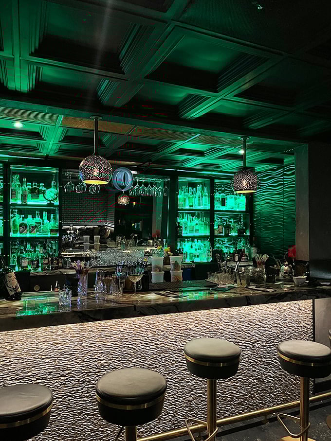 Emerald glow, sleek decor, and drinks crafted with more precision than a Swiss watch. Time flies when you're having rum!