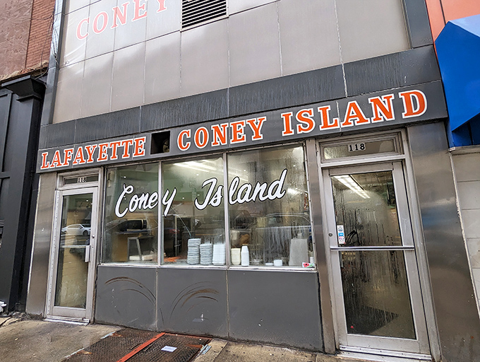 A splash of red, white, and blue beckons hungry patrons. Lafayette Coney Island's exterior is like a patriotic beacon for hot dog lovers.