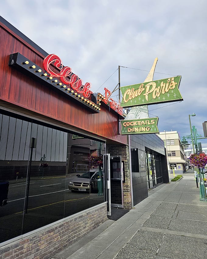 Neon dreams and culinary schemes! Club Paris beckons with its retro sign, promising a night of cocktails, dining, and perhaps a dash of Parisian flair in the heart of Anchorage.
