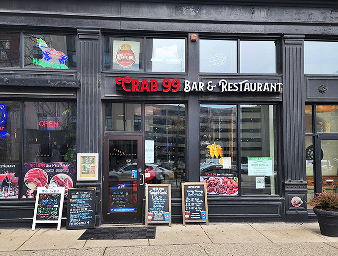 Neon dreams and seafood schemes! Crab 99's storefront beckons like a lighthouse for hungry sailors, promising oceanic delights in the heart of downtown Indy.