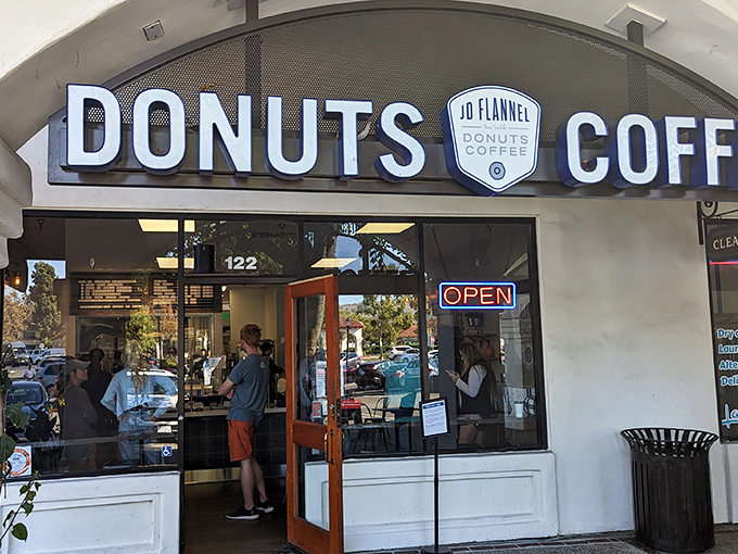 Welcome to donut nirvana! JD Flannel's storefront promises a world of sweet delights, beckoning you like a siren's call to carb-lovers everywhere.