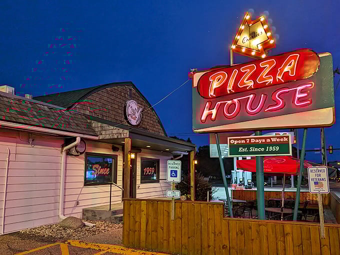 Neon dreams and pizza perfection! Charlie's Pizza House beckons like a lighthouse for the hungry, promising slices of heaven since 1959.
