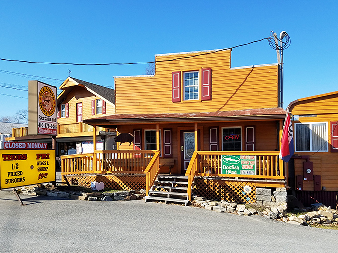 Welcome to barbecue heaven! This sunny yellow facade is like a beacon of hope for hungry souls seeking smoky salvation.