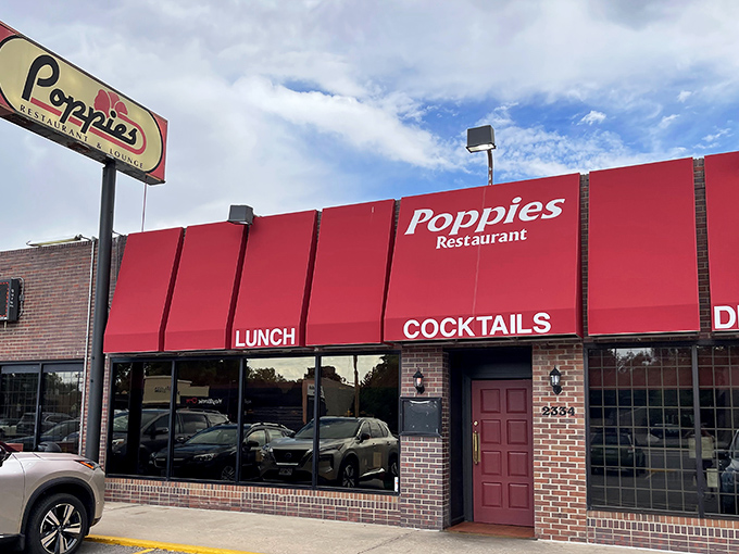 The iconic red awning of Poppies stands out like a beacon for hungry souls on South Colorado Boulevard, promising comfort and satisfaction within.